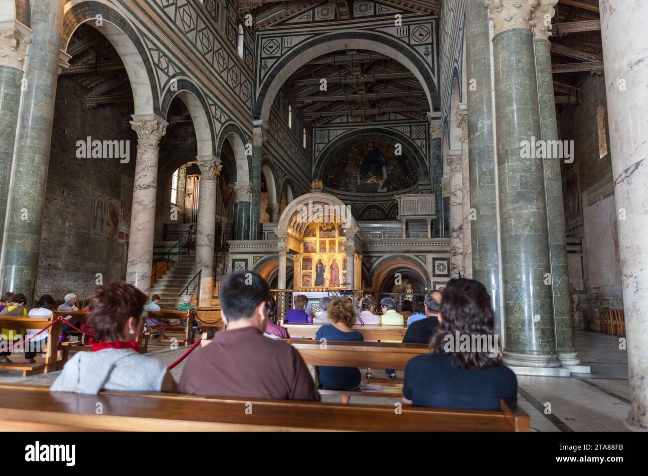 Crowd assembled for a concert inside the Basilica San Miniato al Monte ...