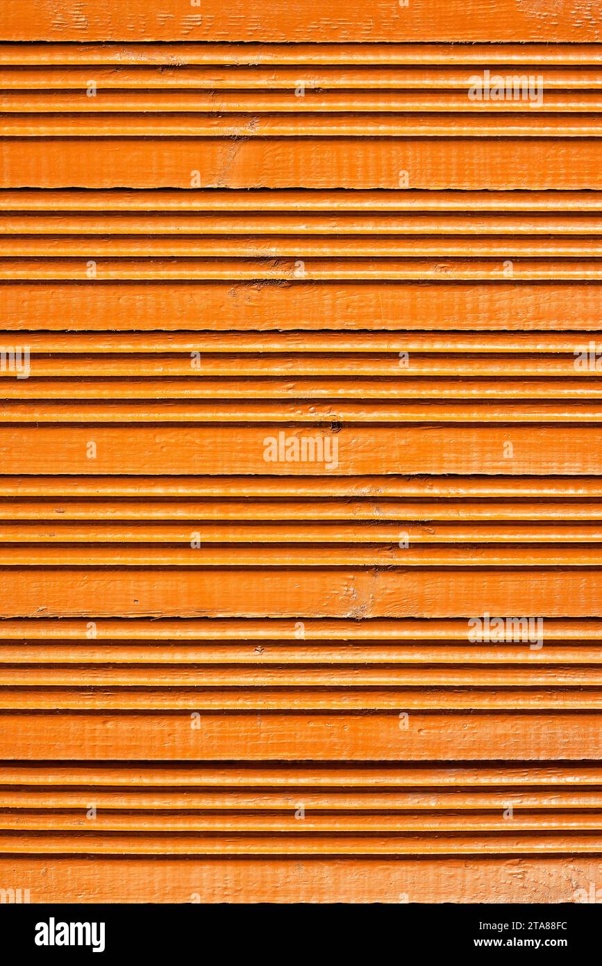 The texture of an old wooden paneling with horizontal lines is painted ...