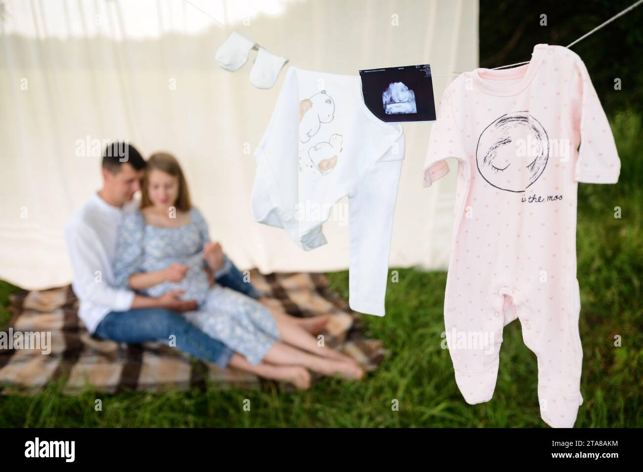 Ivano-Frankivsk, Ukraine June 21, 2023:A man and his pregnant wife are ...