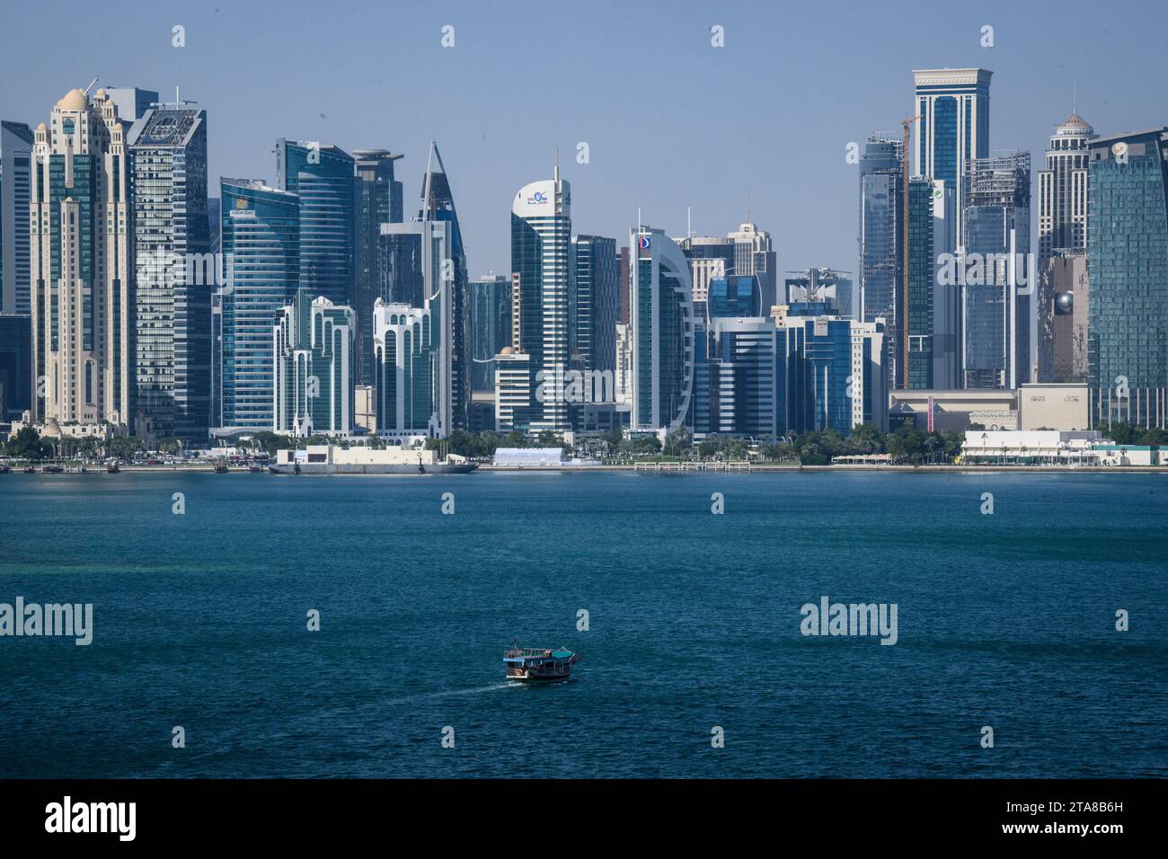 Doha, Qatar. 29th Nov, 2023. A boat passes in front of the skyline of ...
