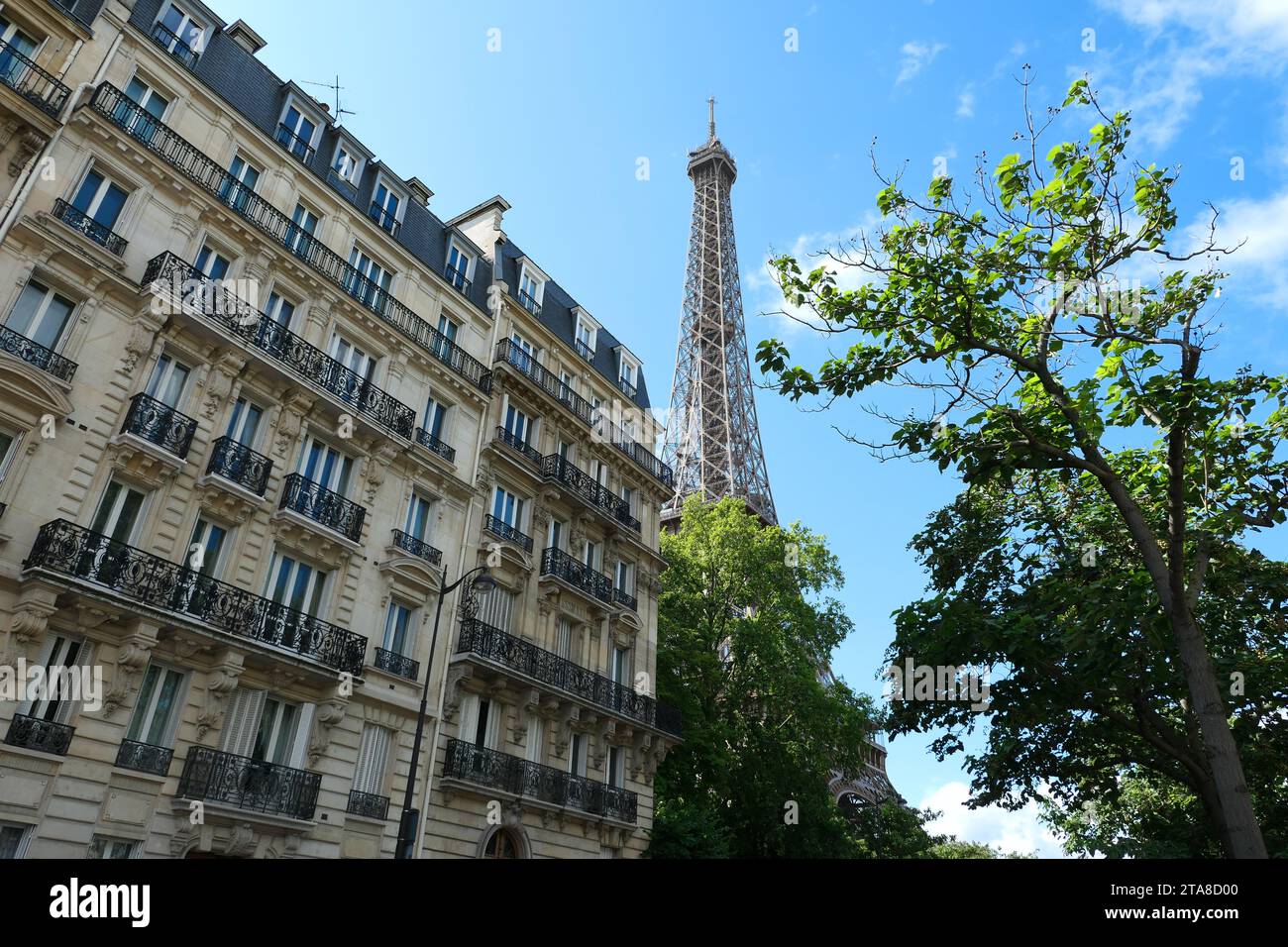 Eiffel tower by day. View on historic monument with old building in the ...