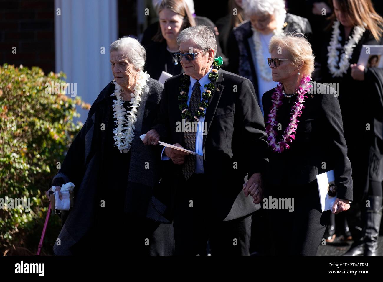 Sybil Spires Carter walks with James "Chip" Carter and his wife Becky ...
