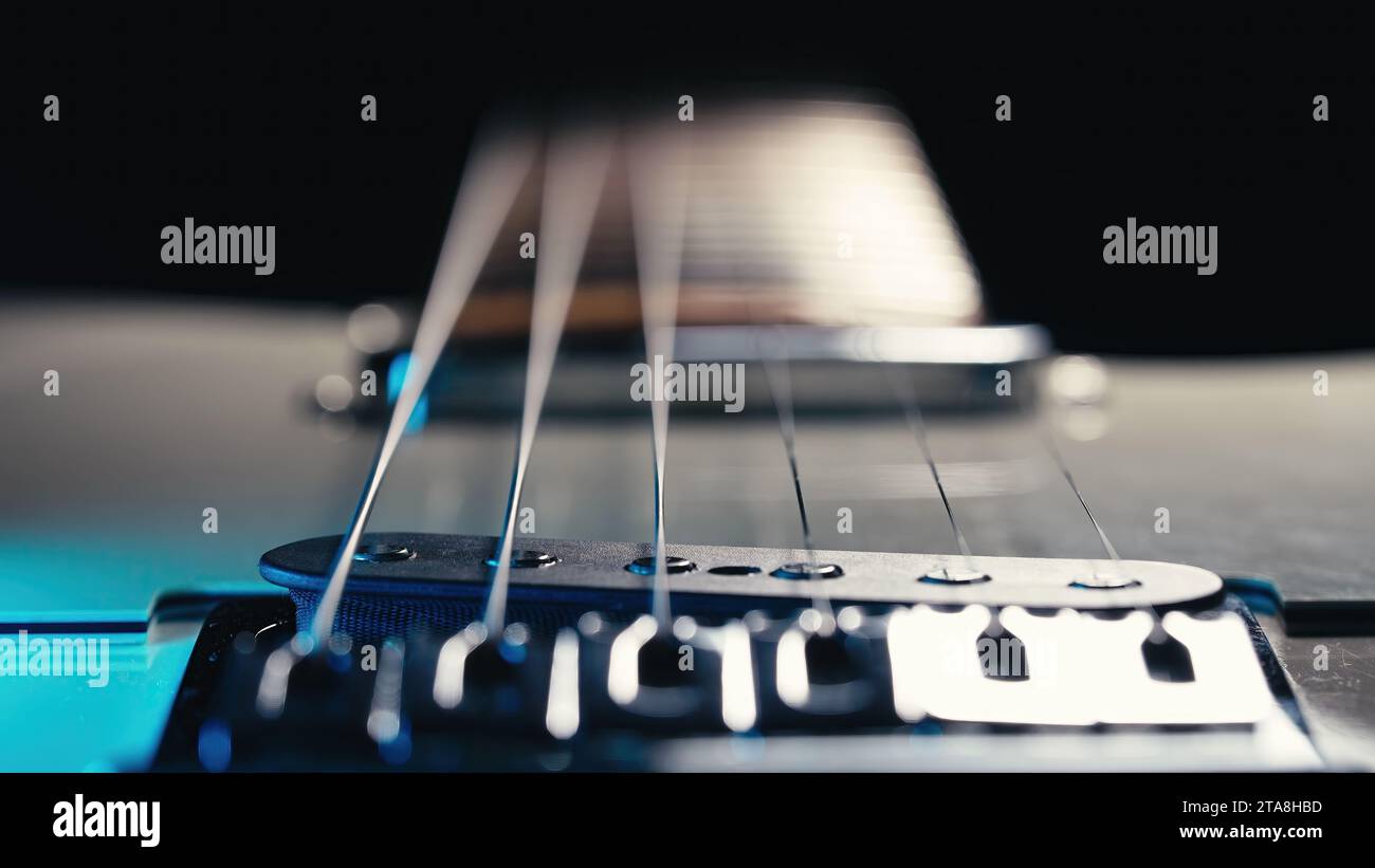 Macro of strings on electric guitar fretboard. Details of instrument ...