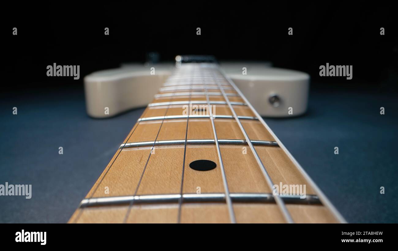 Macro of strings on electric guitar fretboard. Details of instrument ...