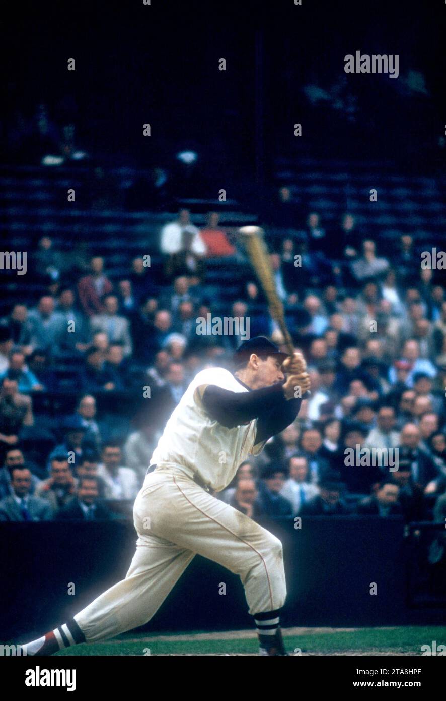 BOSTON, MA - MAY, 1957: Ted Williams #9 of the Boston Red Sox swings at ...