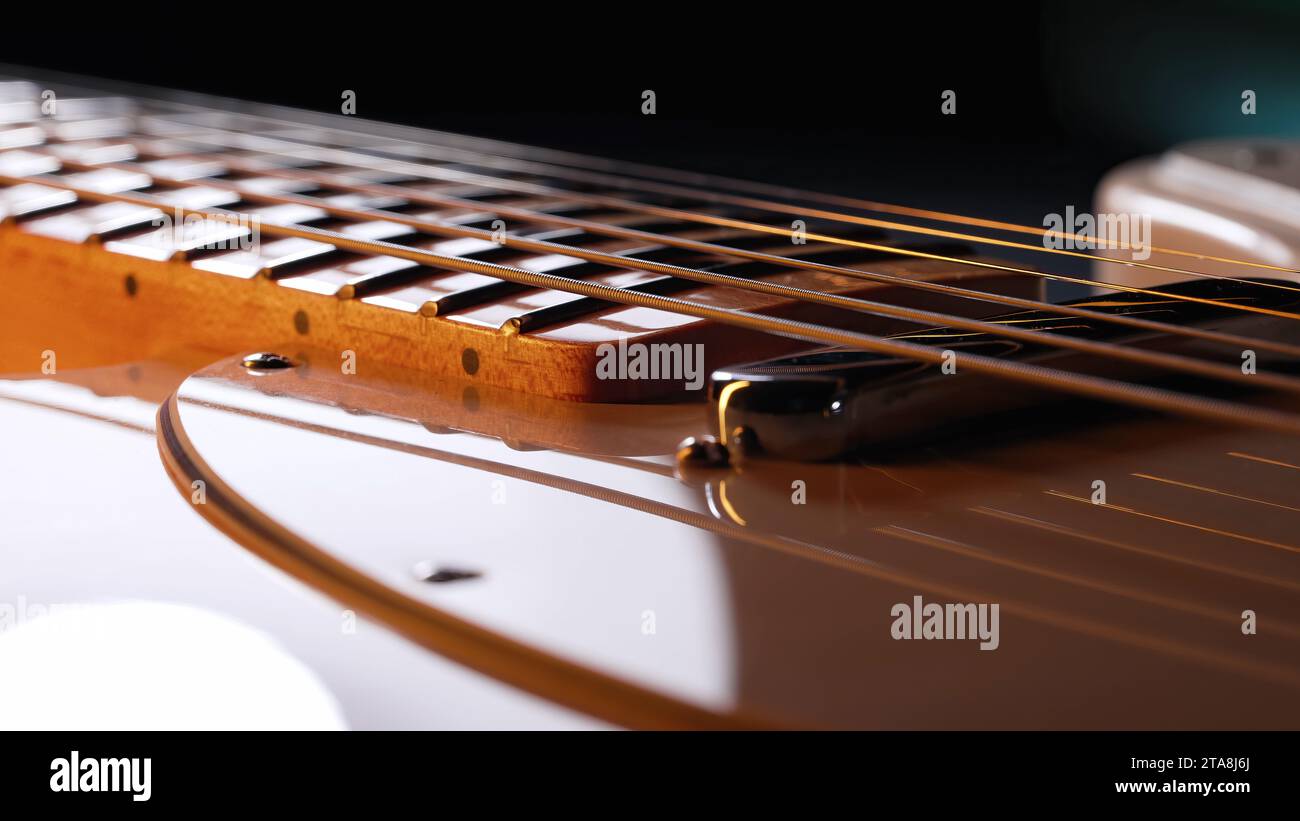 Macro of strings on electric guitar fretboard. Details of instrument ...
