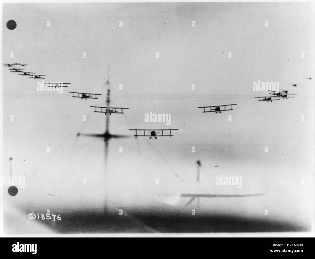 View from airplane of biplanes flying in formation- Frontal view of ...