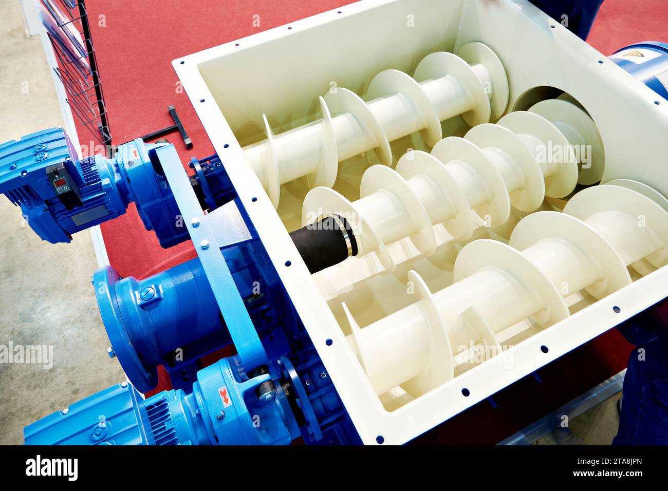 Screw pump with receiving hopper for water treatment Stock Photo - Alamy