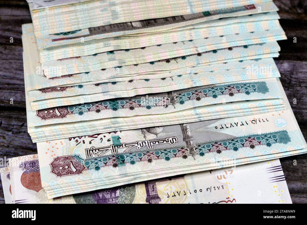 Stacks of Egypt money banknote bills of 200 EGP LE, 100 and 50 EGP LE ...