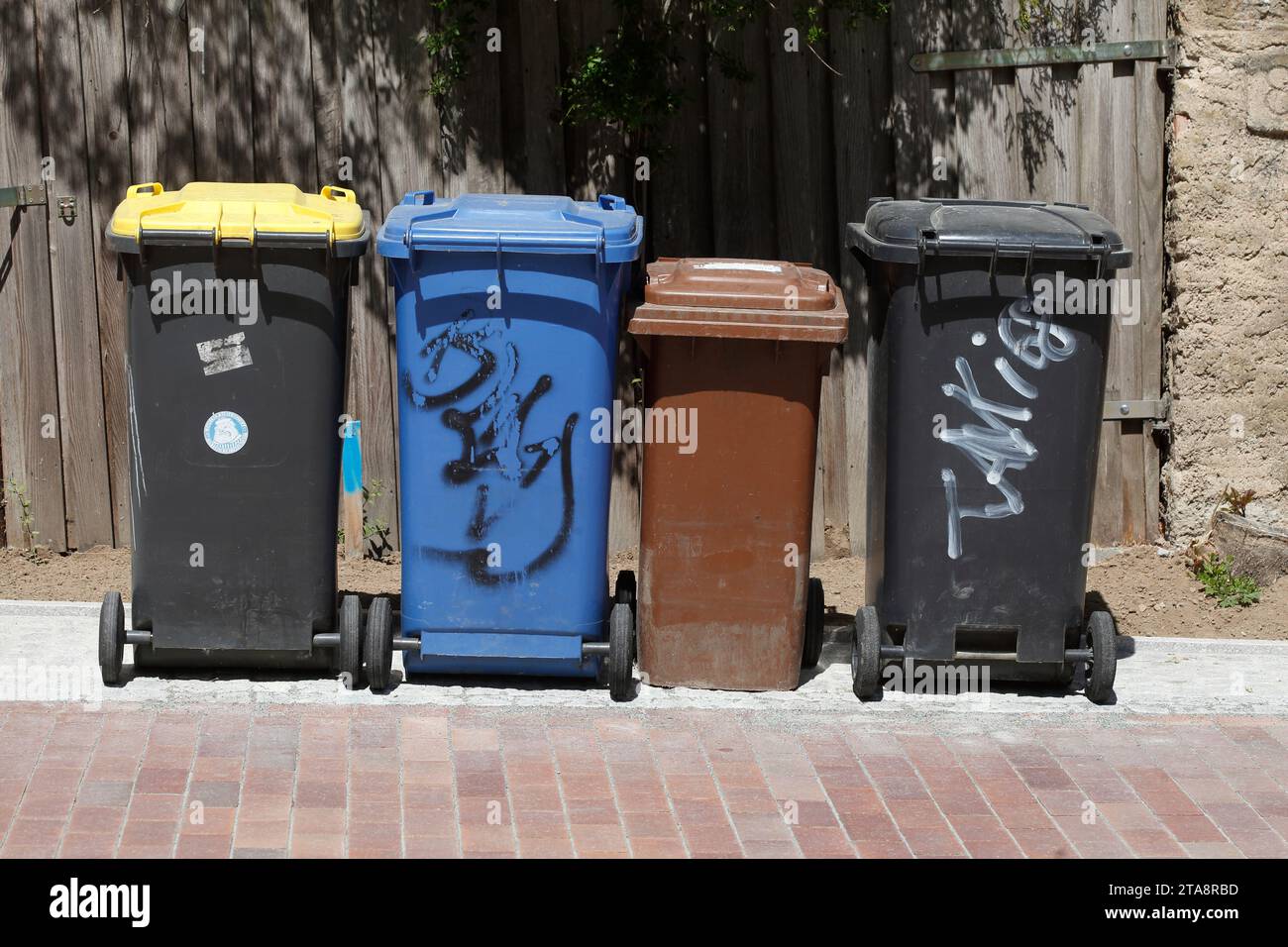 Colourful Different Recyclables And Garbage Cans, Standing On The Road ...
