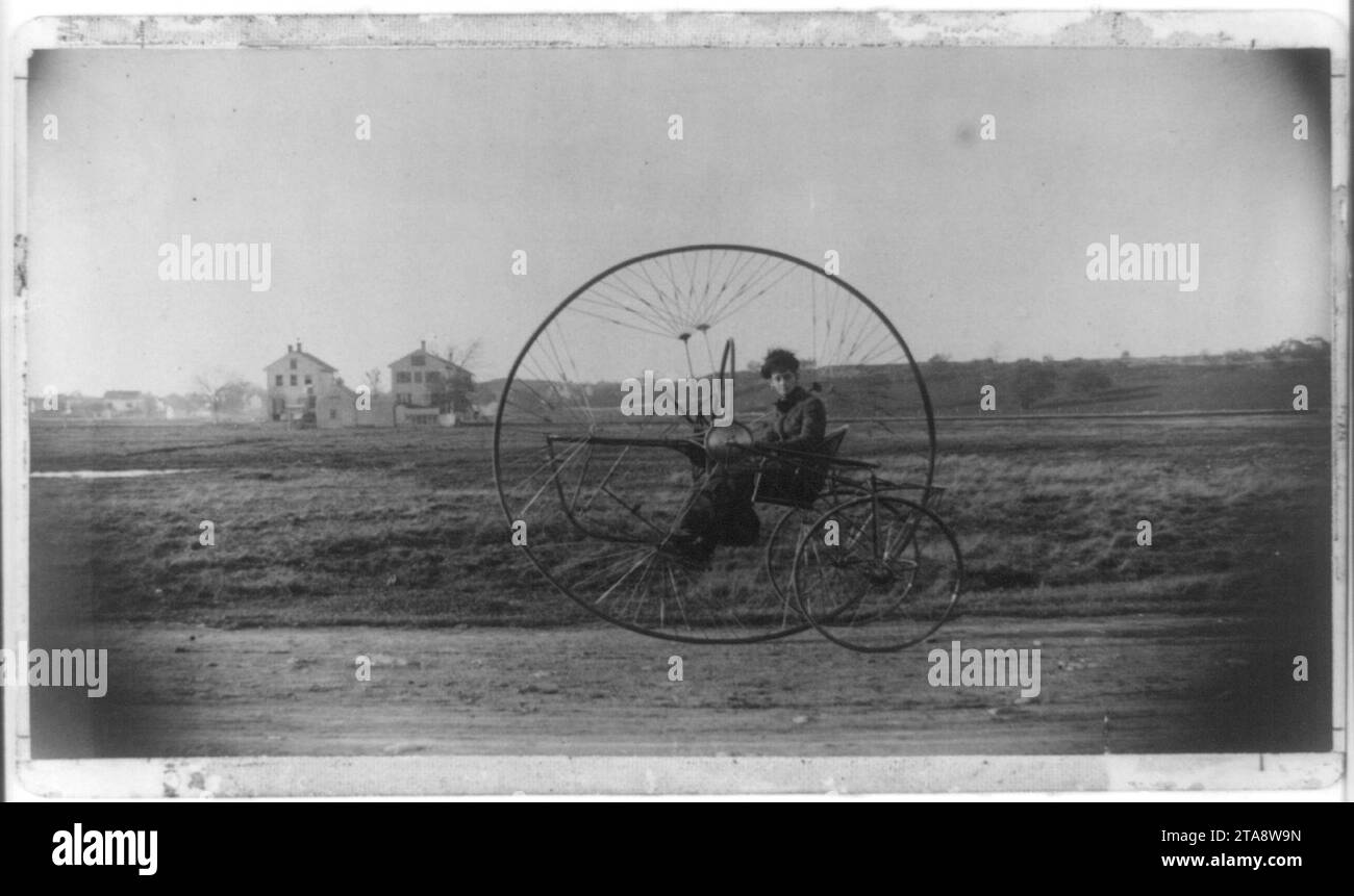 View of Oldreive's new tricycle; the New Iron Horse, with a lady inside ...