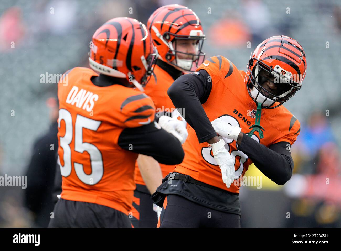 Cincinnati Bengals' Jalen Davis (35) and DJ Ivey, right, warm up prior ...