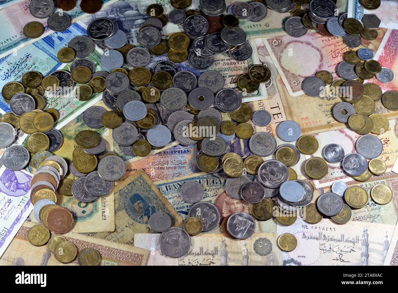 Selective focus of old Egyptian money banknote bills and coins of ...