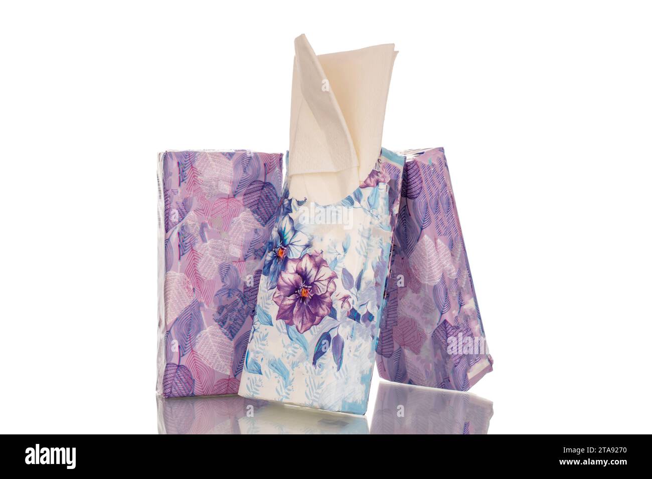 Three packs of paper handkerchiefs, close-up, isolated on white ...