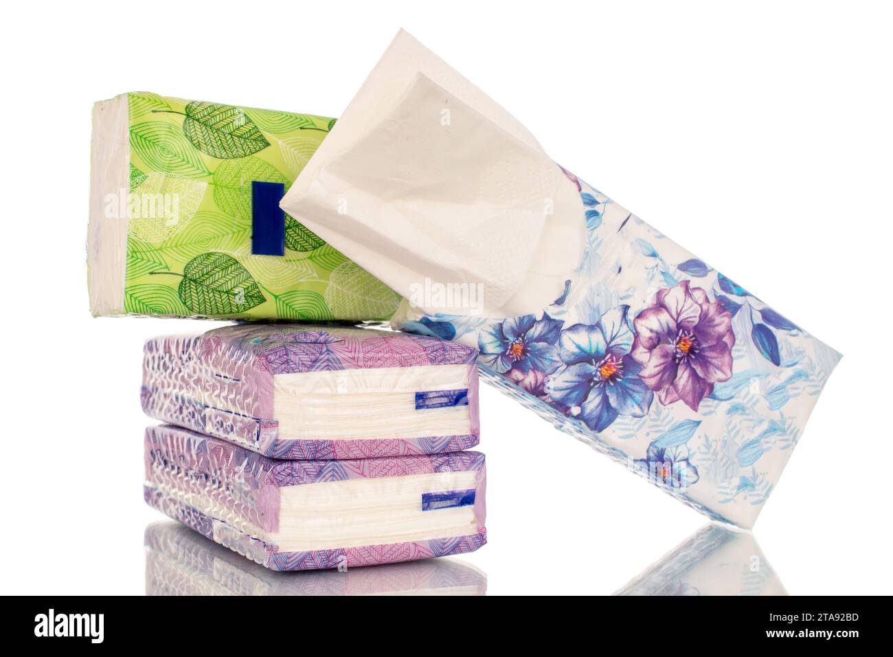 Four packs of paper handkerchiefs, close-up, isolated on white ...