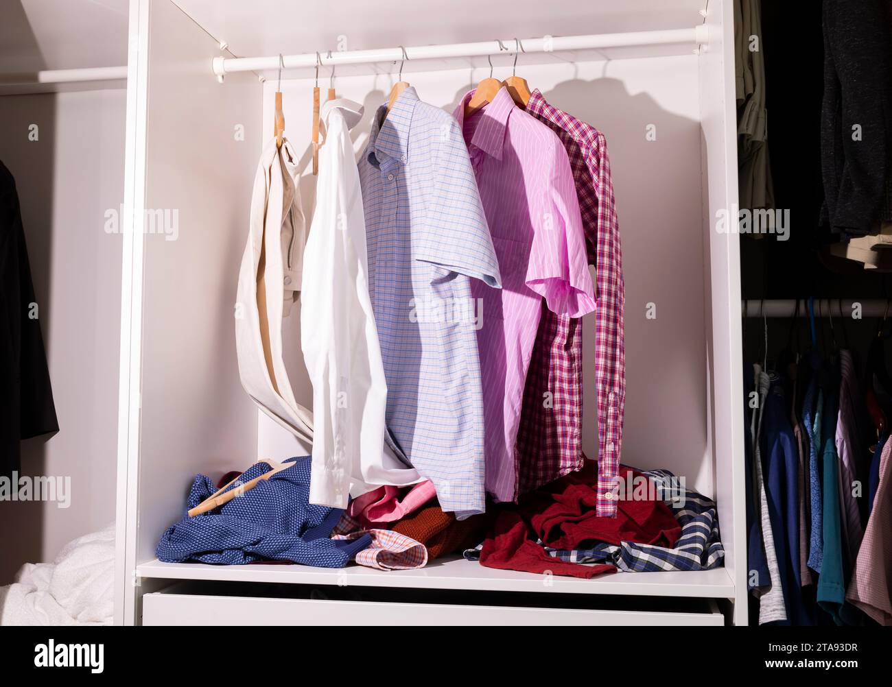 Messy Closet, Wardrobe With Dangling Unfolded Man's Clothes, Scattered ... Messy Closet, Wardrobe With Dangling Unfolded Man's Clothes, Scattered ...