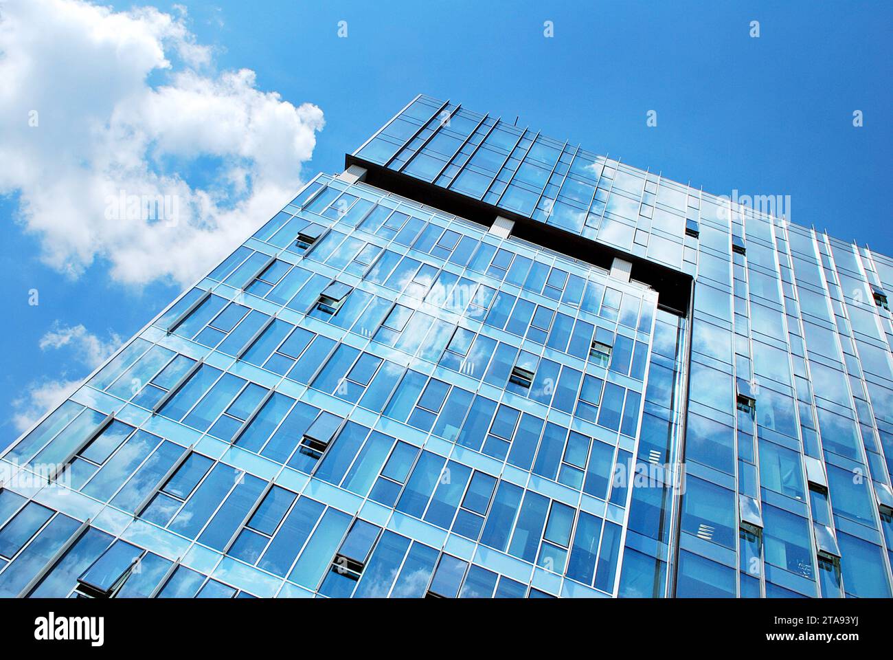 Glass building with transparent facade of the building and blue sky ...