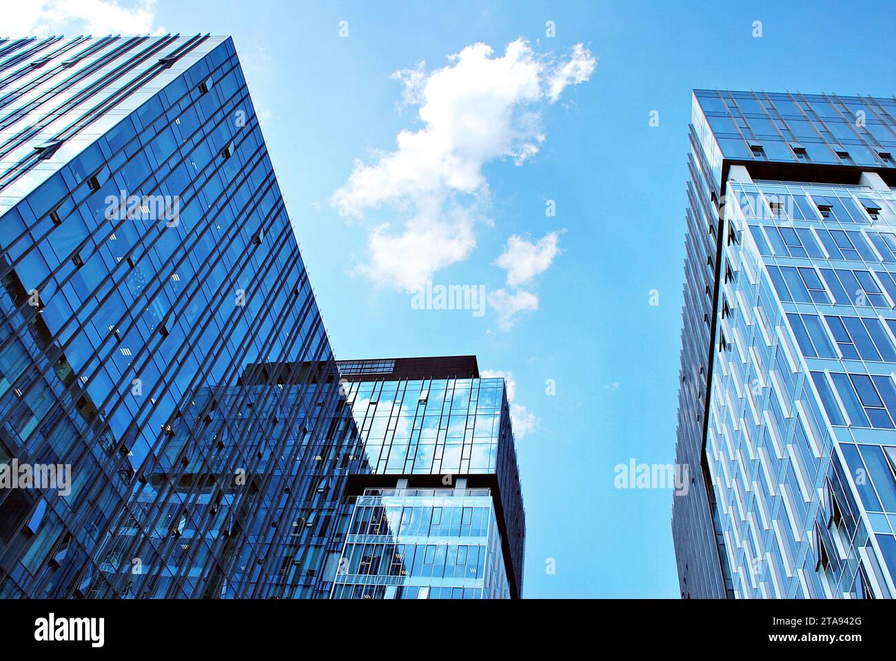Glass building with transparent facade of the building and blue sky ...