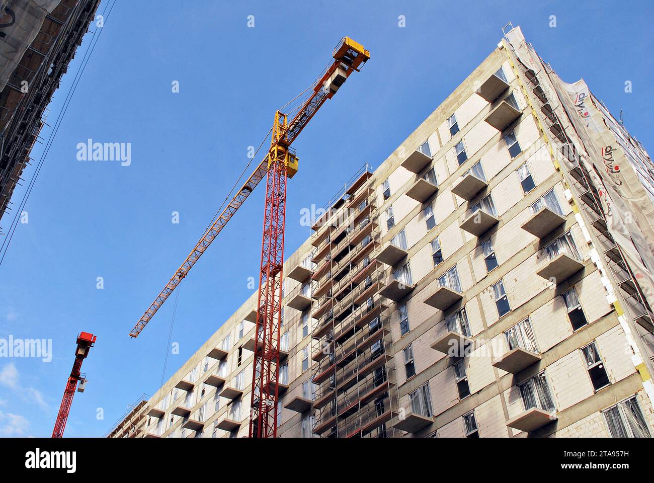 High rise building under construction. Installation of glass facade ...