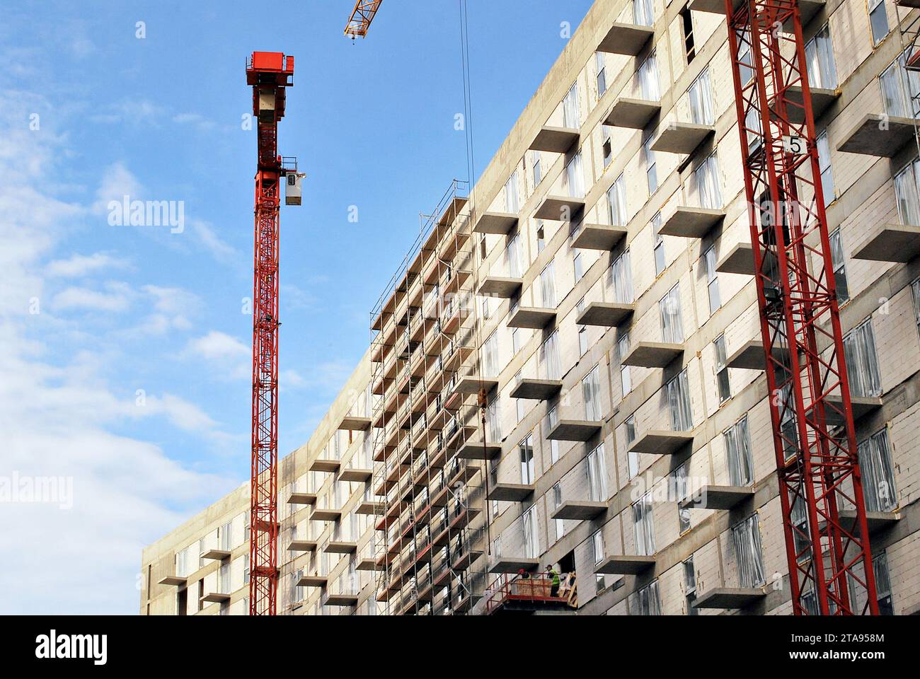High rise building under construction. Installation of glass facade ...