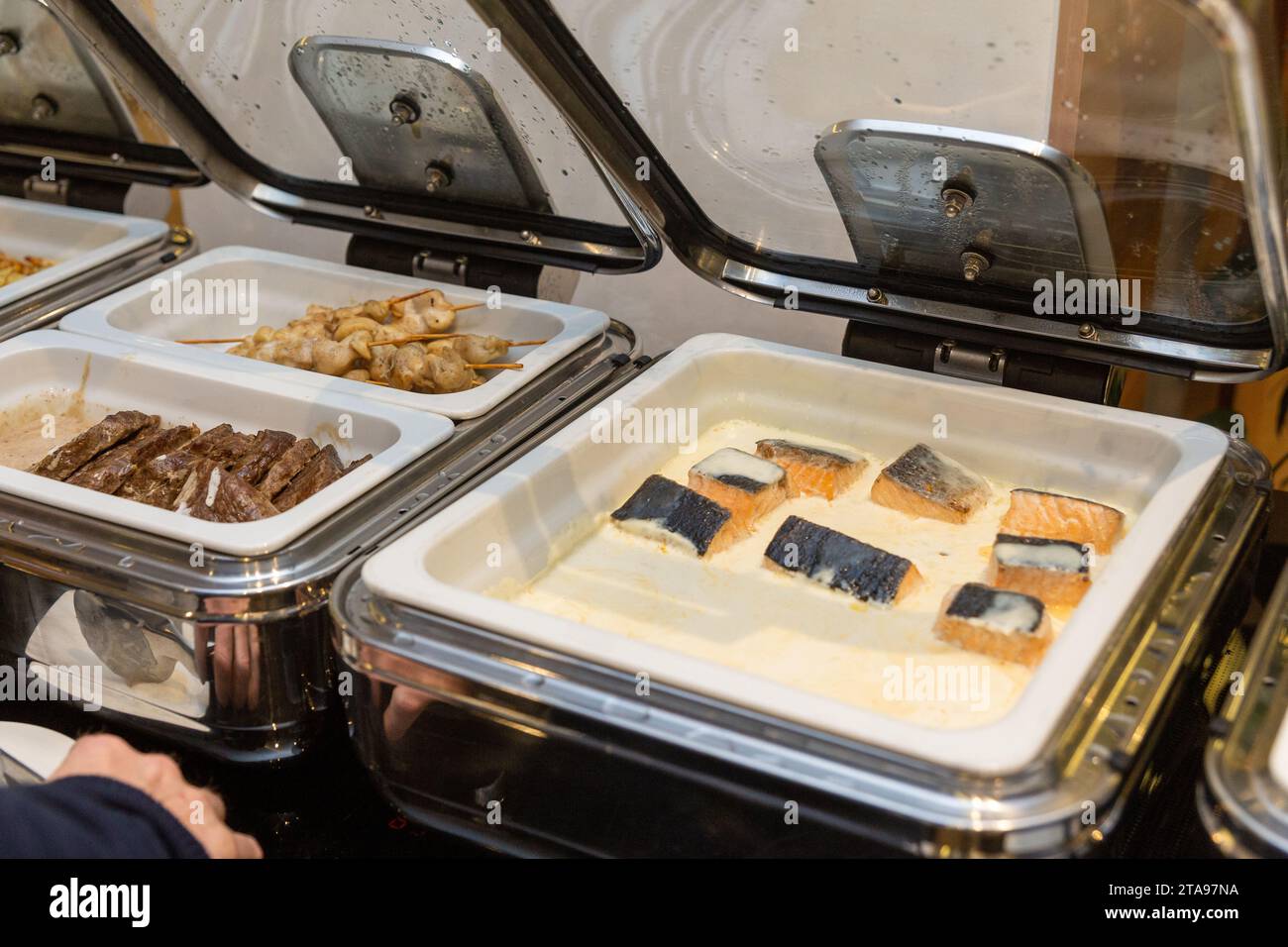 Row of open buffet food dishes at party banquet hall. Chafing Dish ...