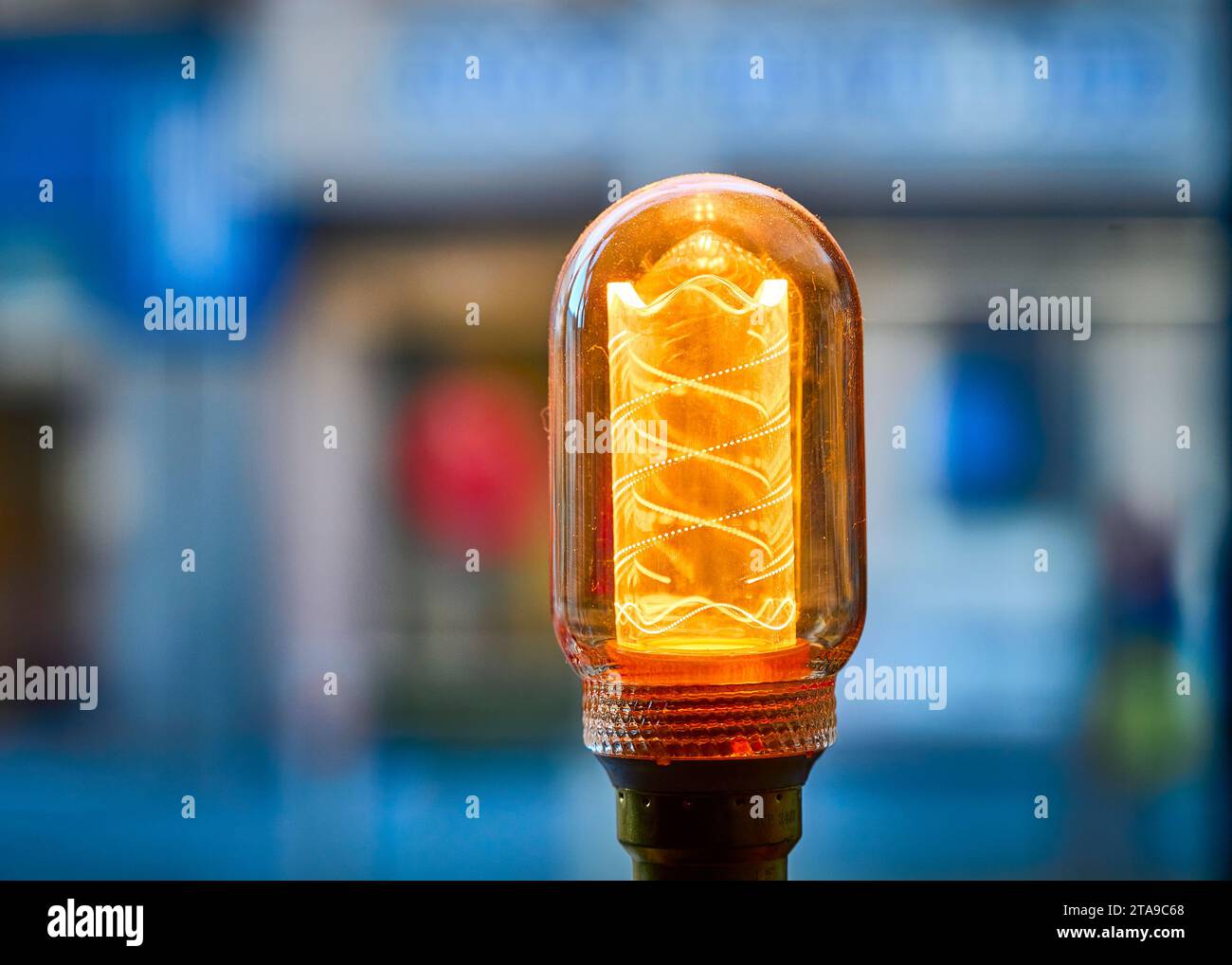 Small electric light bulb in window Stock Photo - Alamy