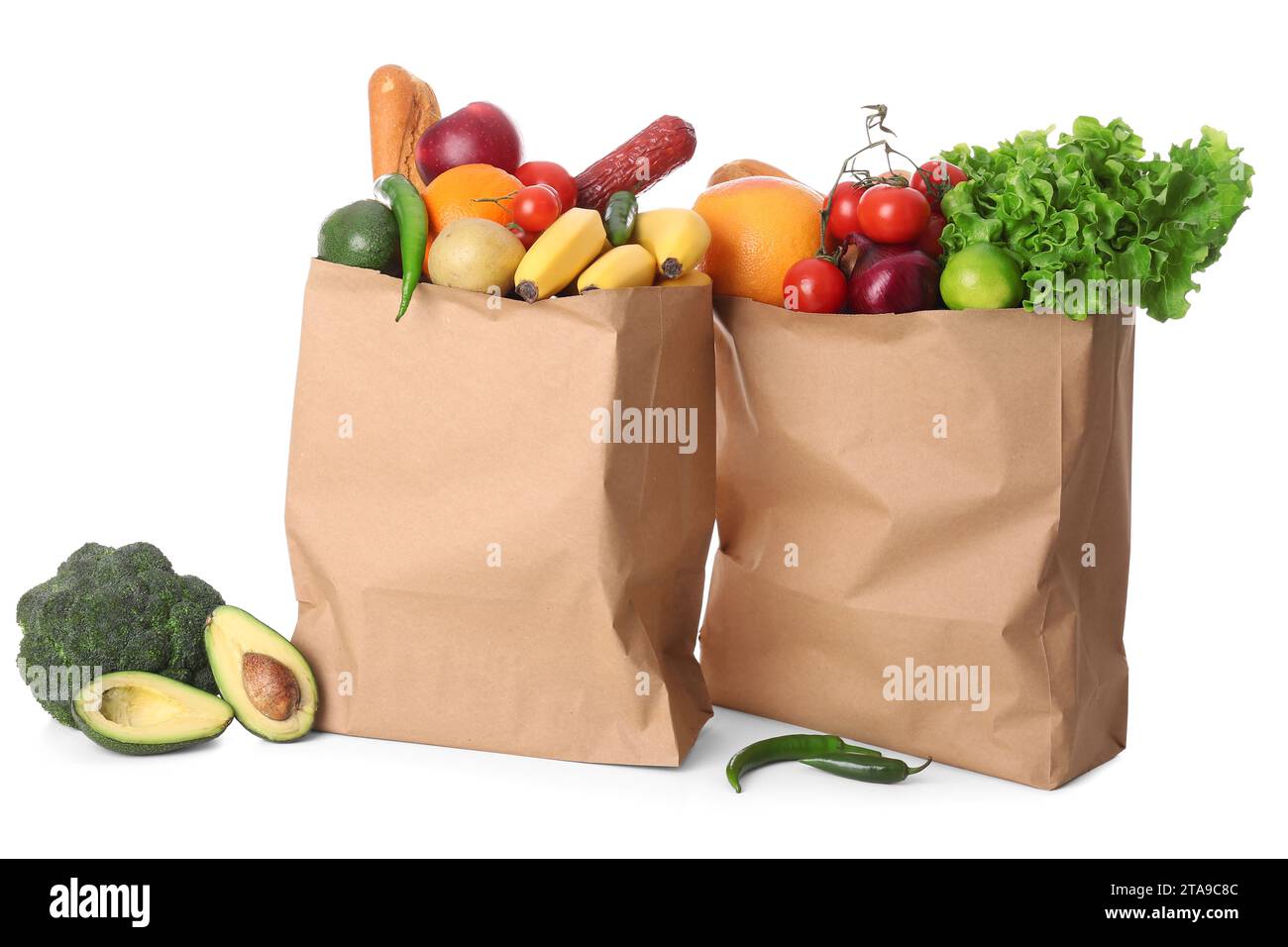 Paper bags with vegetables and fruits on white background Stock Photo ...