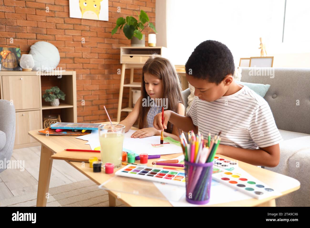 Cute little children drawing at home Stock Photo - Alamy