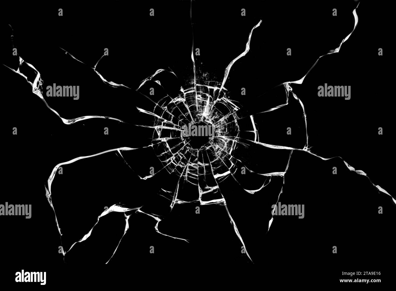 Broken glass from a bullet. Texture of broken glass Stock Photo - Alamy