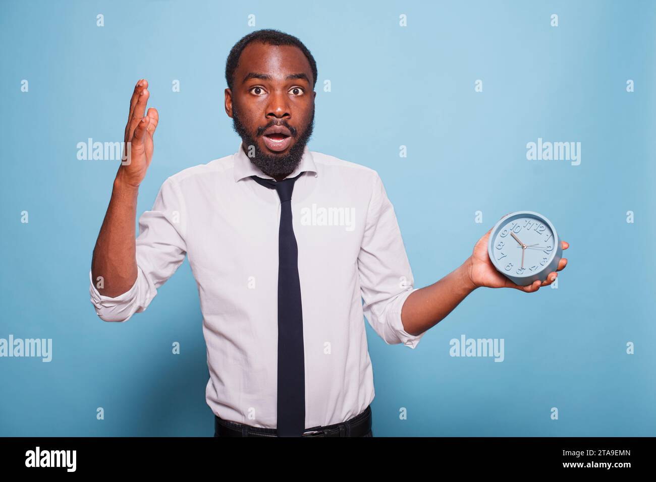 African American male entrepreneur shockingly looking at clock before ...