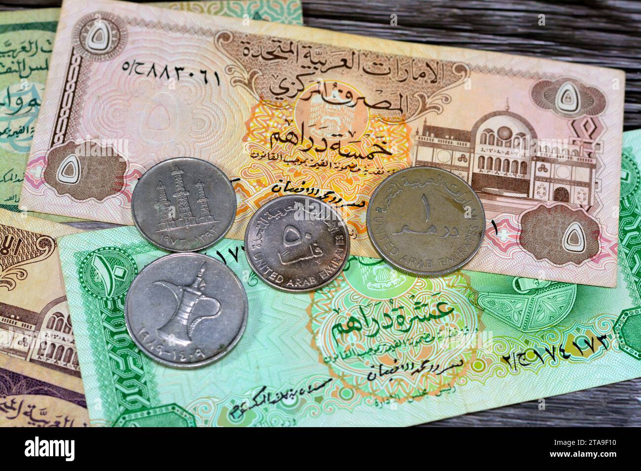 United Arab of Emirates money background of old coins and banknotes of ...