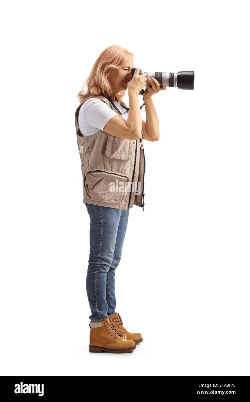 Female photo journalist using a camera isolated on white background ...