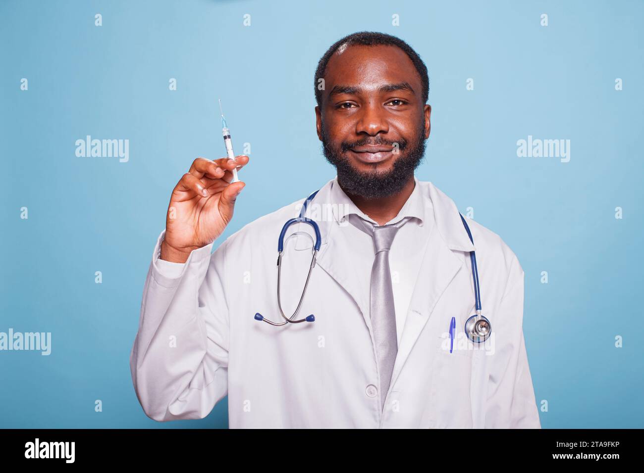 Professional doctor holding a syringe in preparation for giving ...