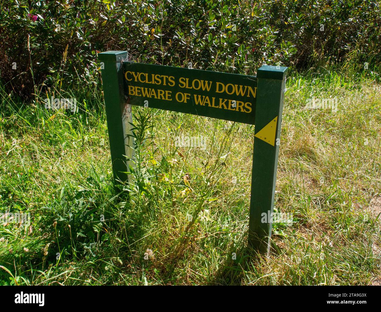 Cyclists Slow Down Beware Of Walkers Sign Stock Photo - Alamy
