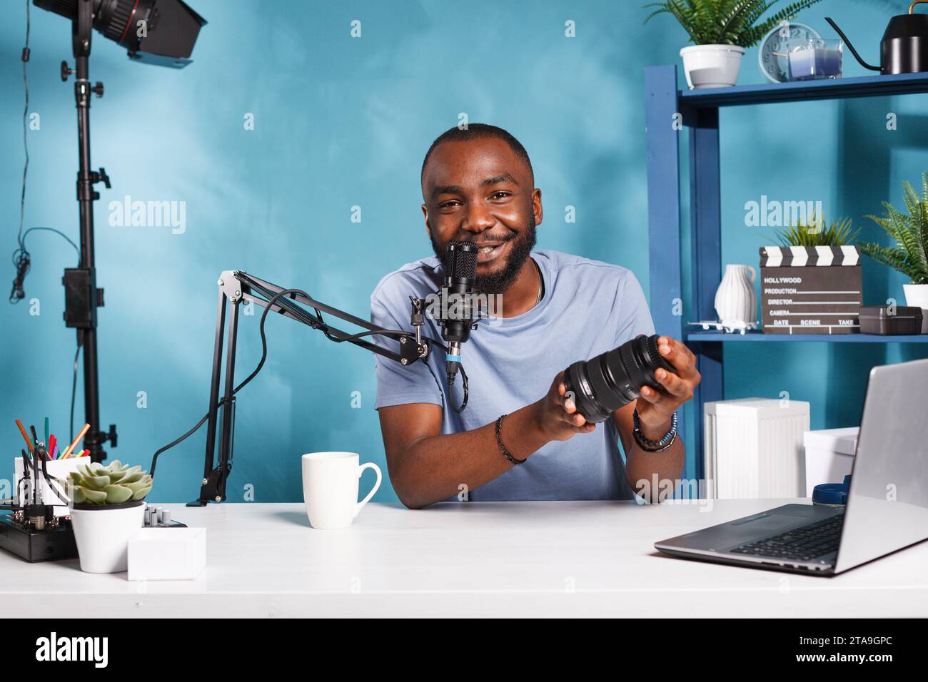 Smiling vlogger holding giveaway hi-res stock photography and images ...