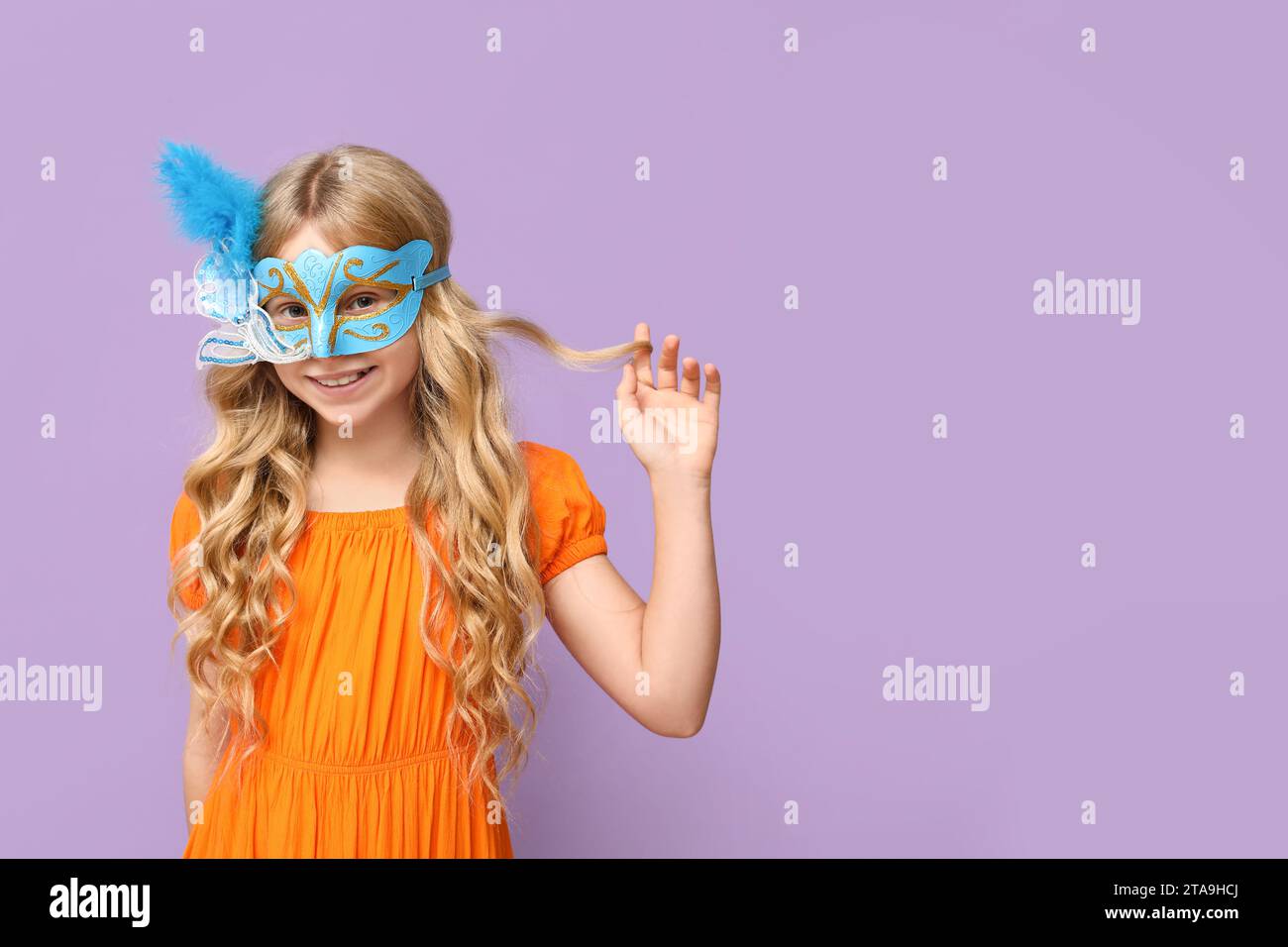 Adorable little girl wearing carnival mask on lilac background Stock ...