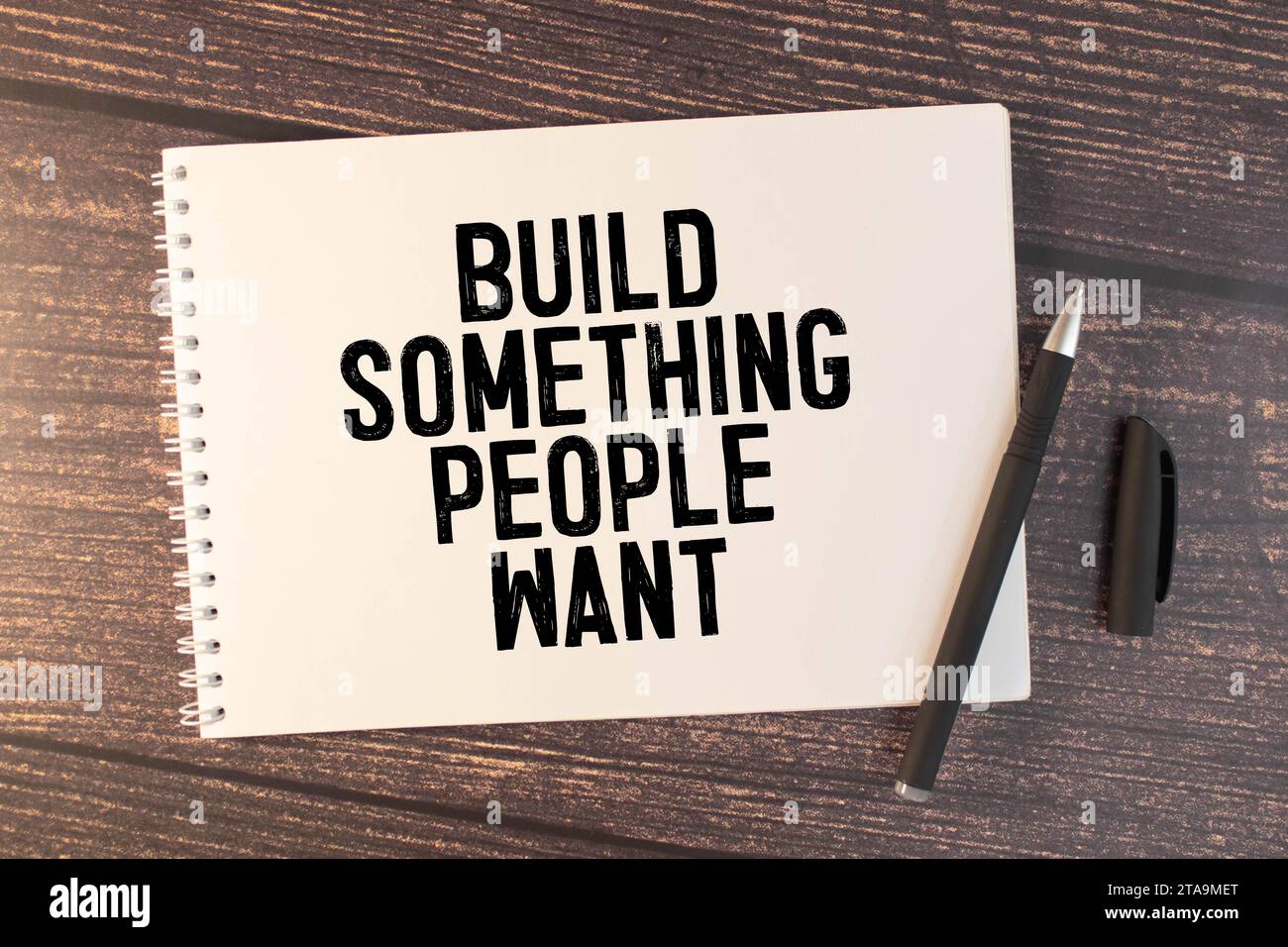 Build something people want. text on white notepad on craft background ...