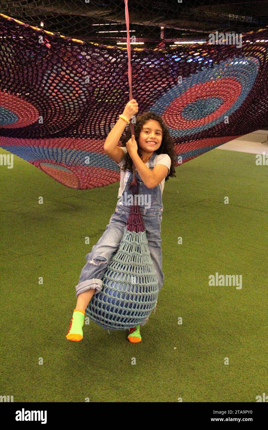 Hispanic swing girl 9 year old hi-res stock photography and images - Alamy
