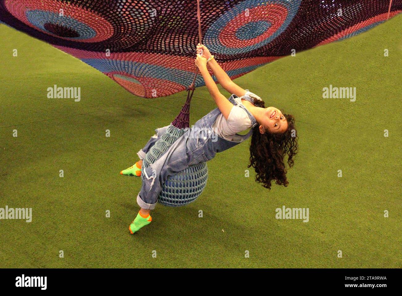 Hispanic swing girl 9 year old hi-res stock photography and images - Alamy