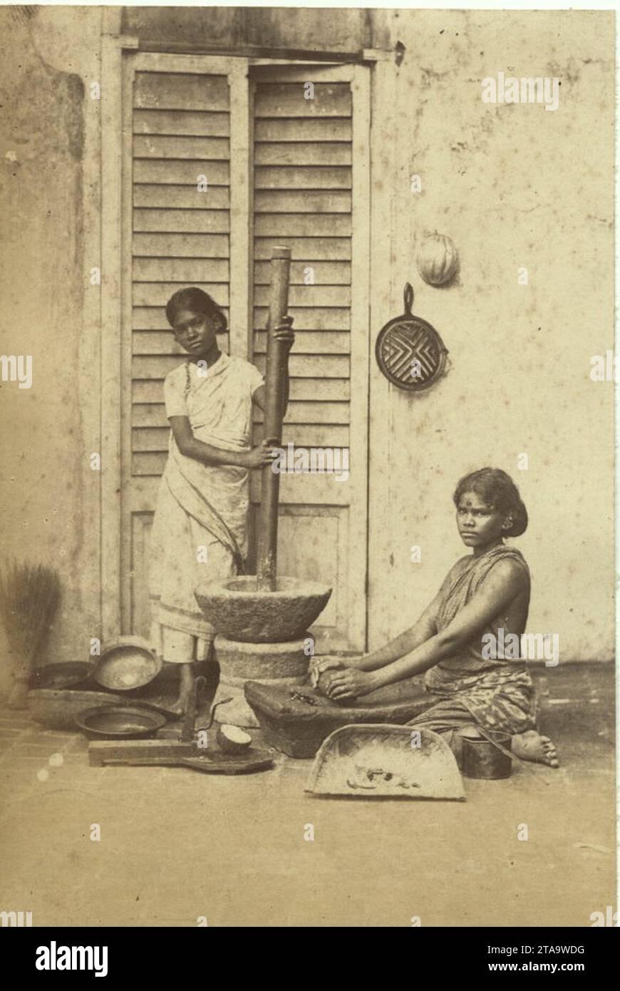 Women grinding corn hi-res stock photography and images - Alamy