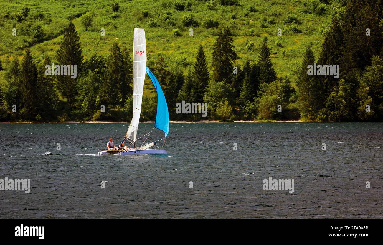 Person sailing catamaran on Lake Bohinj, Triglav National Park, Upper ...