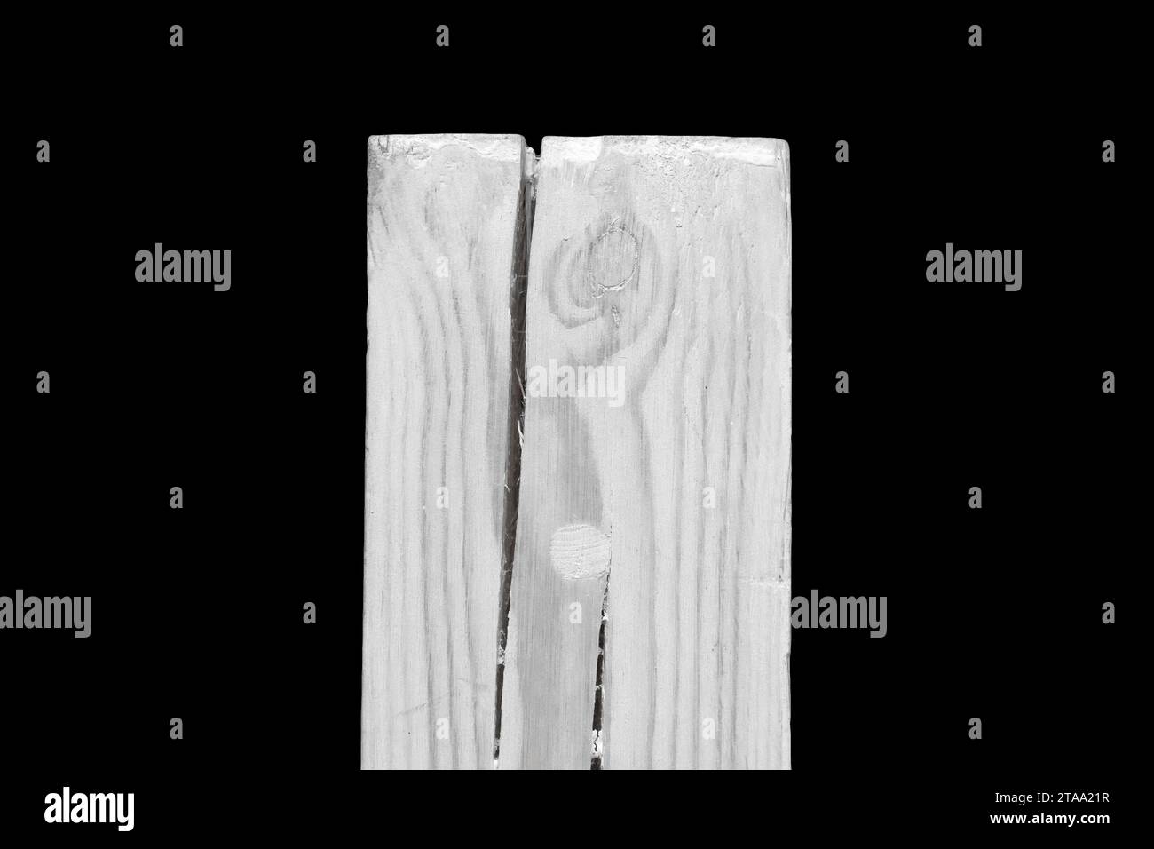 Wooden grey block with cracked wood object close-up on black background ...