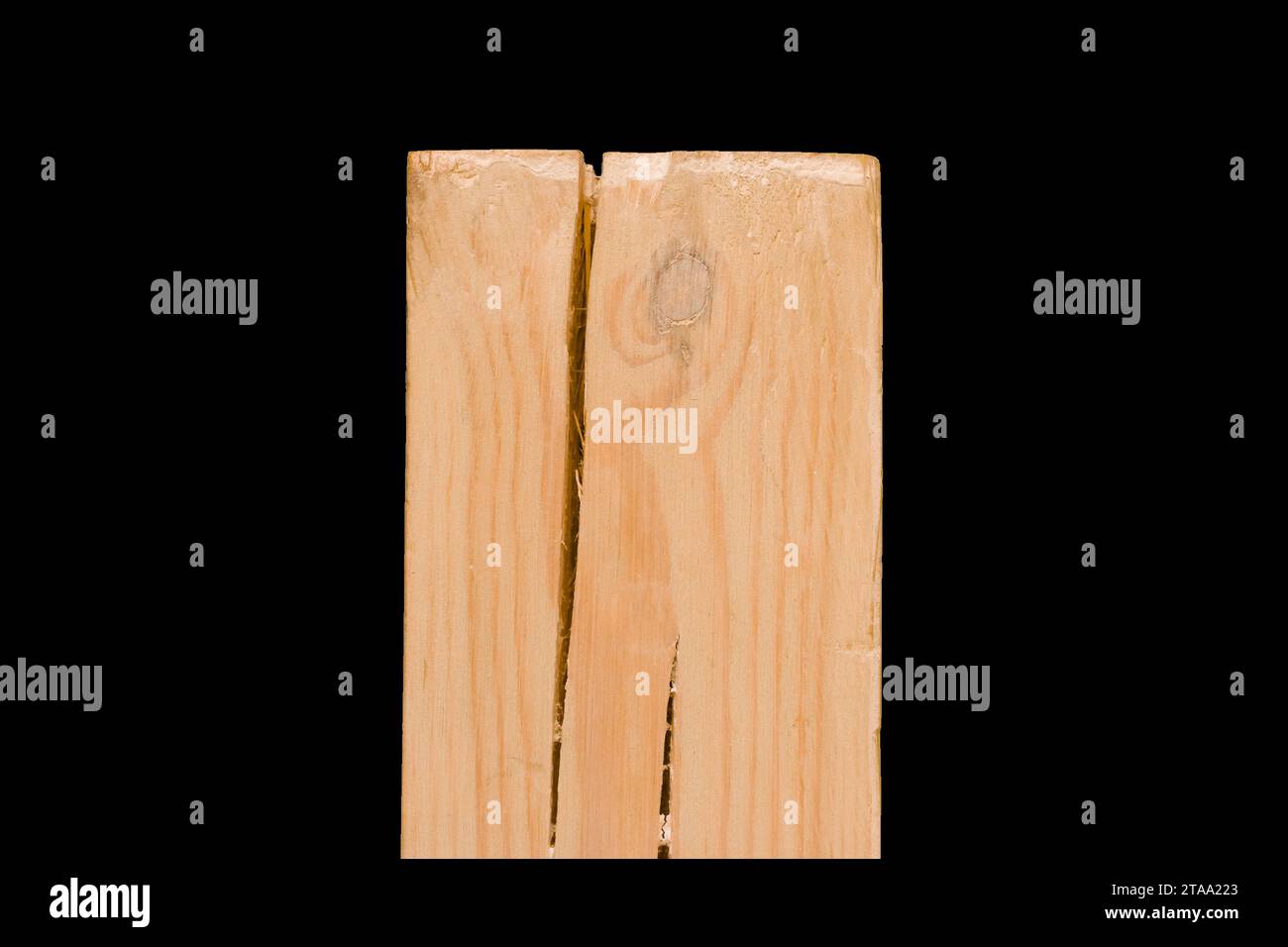 Wooden block with cracked wood object close-up on black background ...