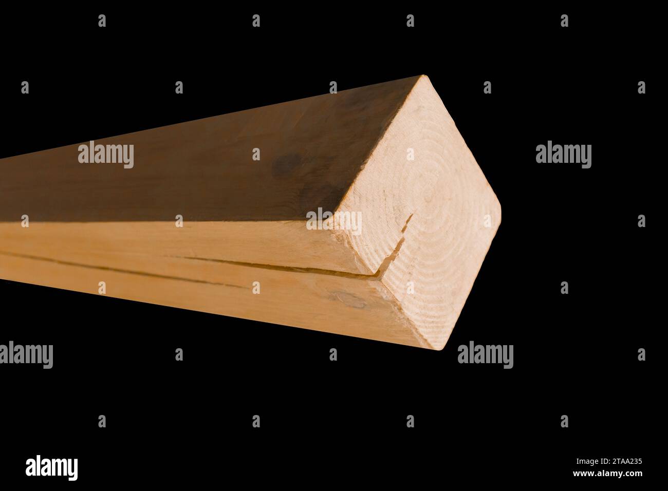 Wooden block plank with cracked wood object close-up on black ...