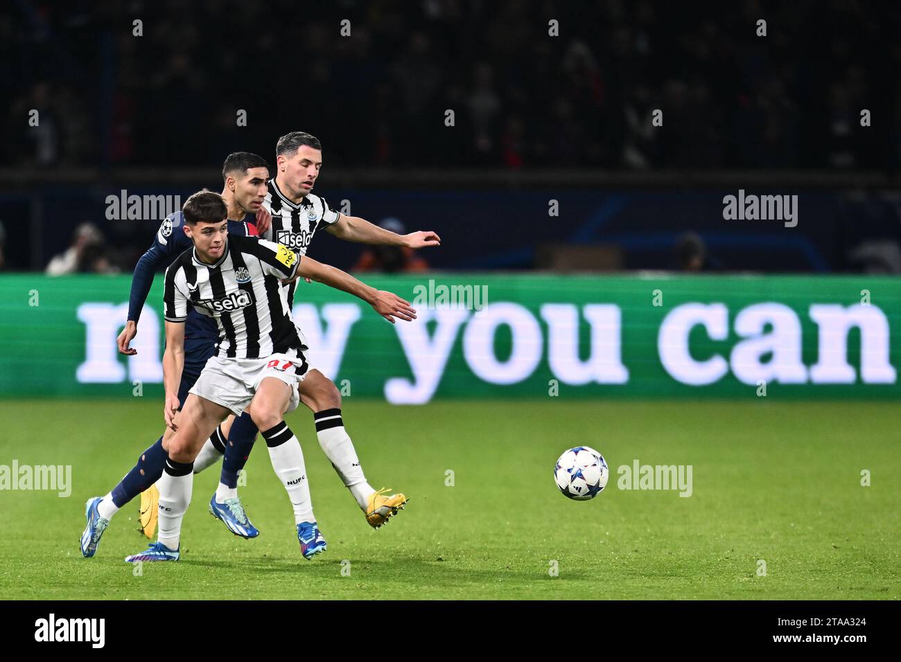 PARIS, FRANCE - NOVEMBER 28: Achraf Hakimi of PSG and Lewis Miley of ...