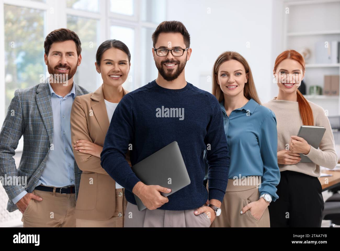 Portrait of happy employees in office. Team work Stock Photo - Alamy