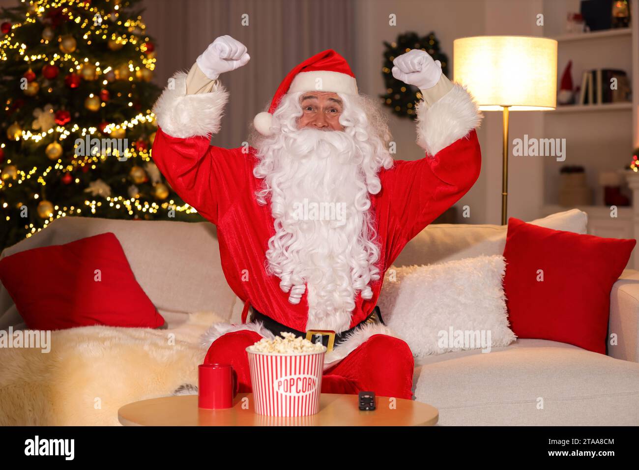 Santa watching tv hi-res stock photography and images - Alamy