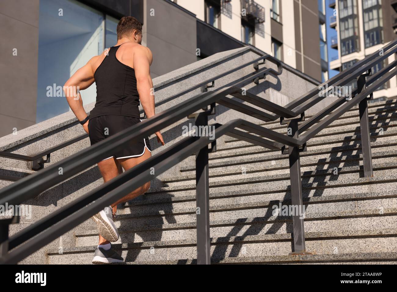 Man running up stairs hi-res stock photography and images - Alamy