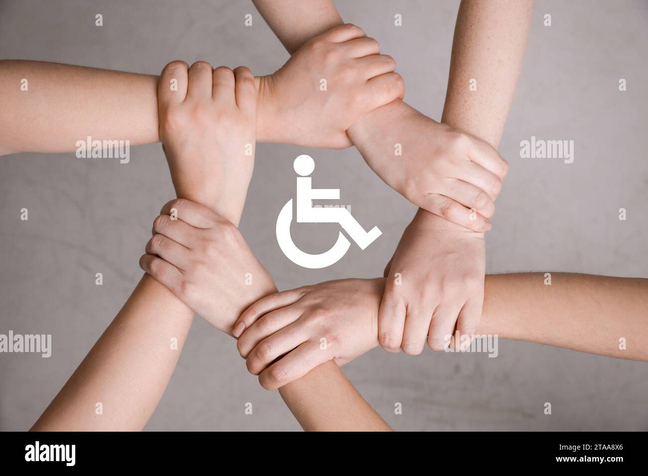 Inclusion concept. People holding hands together around international ...