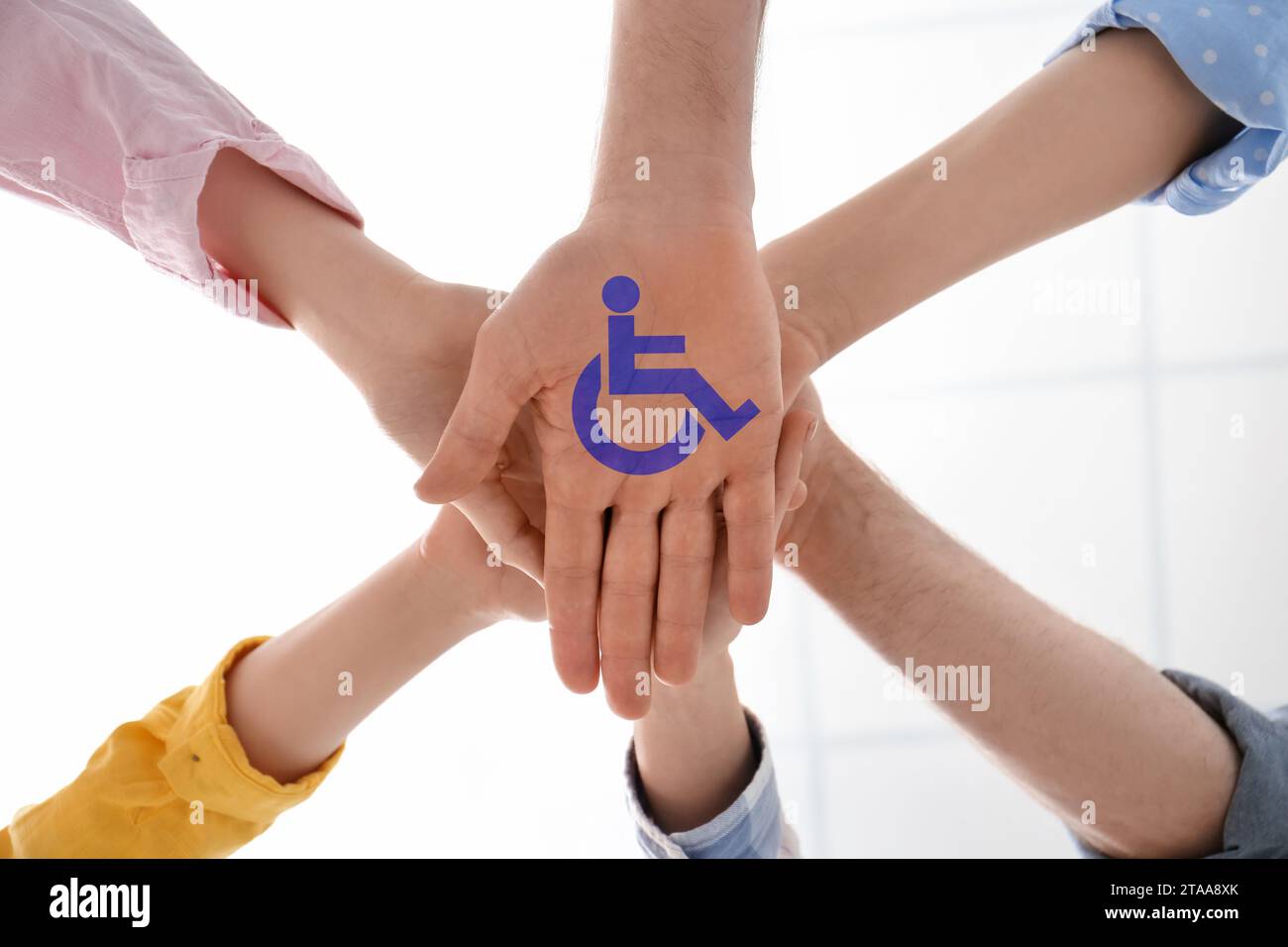 Inclusion concept. People holding hands together, bottom view ...